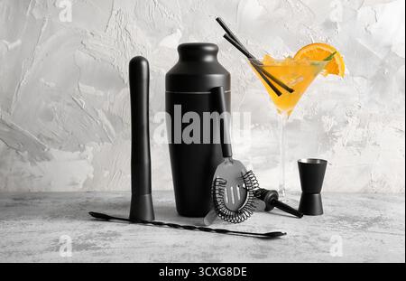 Different bartender tools on grey background Stock Photo - Alamy