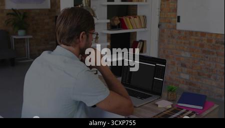 Laptop, glasses and succulent on the wooden background. Magnifier glass ...