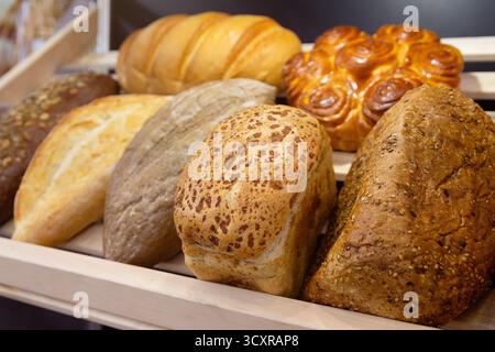 Assortment of fresh artisanal sourdough breads. High quality photo ...