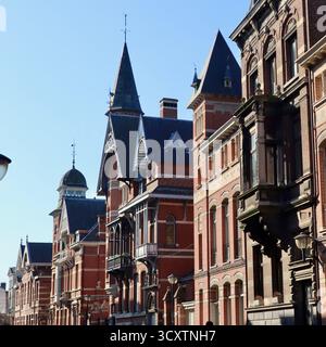 Historic eclectic townhouses in Antwerp, featuring intricate red brick ...