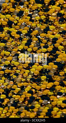 3D render of orange metallic glowing and reflecting disco ball isolated ...