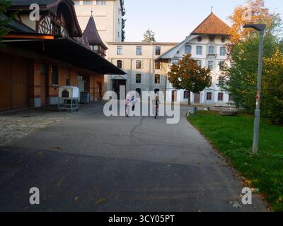 Children at Play in an Autumn Courtyard Stock Photo - Alamy