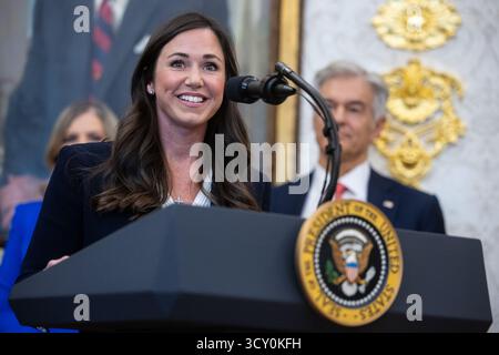 Sen. Katie Britt (R-Ala.) speaks with reporters as she walks to a vote ...