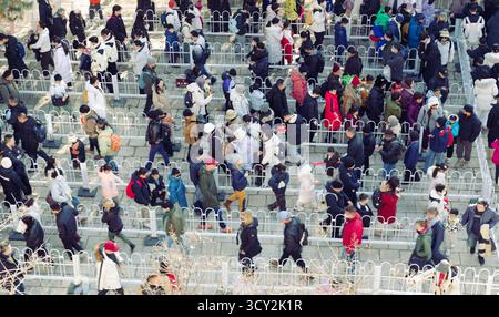 Crowd queues in zigzag lines at the Mutianyu Great Wall entrance in ...
