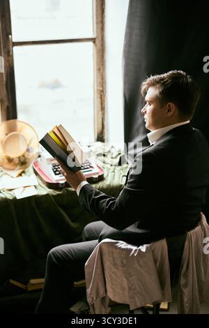 Vintage typewriter with book on table in garden Stock Photo - Alamy
