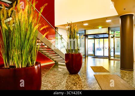 Modern Office Lobby With Large Planters And Glass Entrance ...