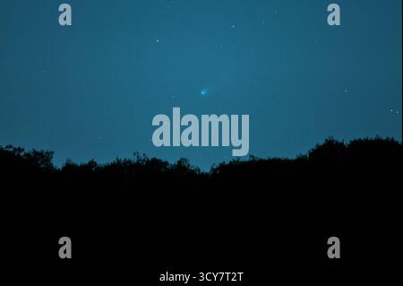 Comet Lemmon is seen in the sky beyond the Saint Joseph the Woodworker ...