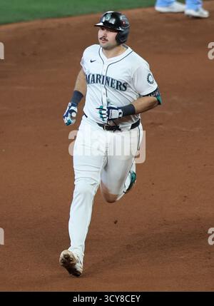 Seattle Mariners' Cal Raleigh runs up the first base line during a ...