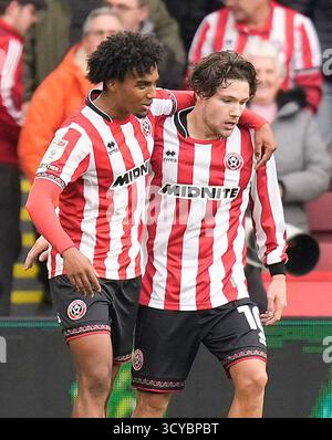 Sheffield United's Callum O'Hare (right) celebrates with Sam McCallum ...