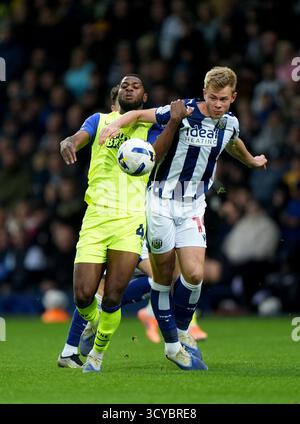 Preston North End's Odel Offiah (left) and Millwall's Zak Sturge in ...