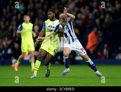 Preston North End's Odel Offiah (left) and Millwall's Zak Sturge in ...