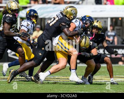 Central Florida defensive end Malachi Lawrence (51) is helped by ...