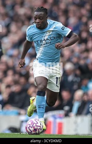 Jeremy Doku of Manchester City breaks with the ball during the Premier ...