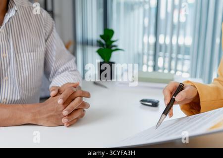 Car sale female broker signing rental contract with businessman ...
