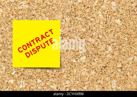 Yellow note paper with word disagree on cork board background with copy ...