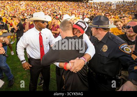 Texas Tech head coach Joey McGuire holds up the trophy after his team's ...