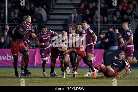 Arron Reed, of Sale Sharks runs towards Harrison Obatoyinbo, and Alex ...