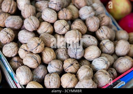 Whole walnuts in box at farmers market Stock Photo - Alamy