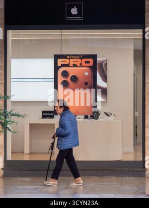 A person walks past a digital display showing a temperature of minus 33 ...