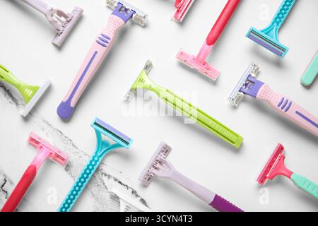 Composition with disposable shaving razors on marble background Stock ...