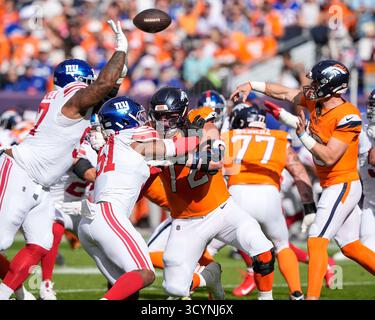 New York Giants linebacker Abdul Carter holds a ball next at the Locker ...