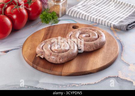 Raw meat pork and beef swirl sausages for grill Stock Photo - Alamy