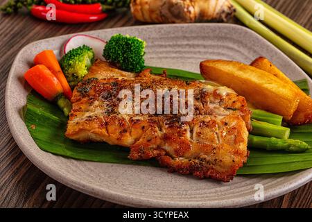 Gourmet asian Grilled crocodile steak served potato and asparagus Stock ...