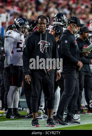 Atlanta Falcons head coach Raheem Morris laughs on the field before an ...