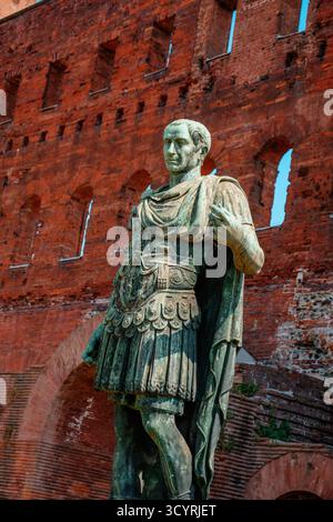 Porta Palatina Turin, view of a statue of the roman emperor Augustus ...
