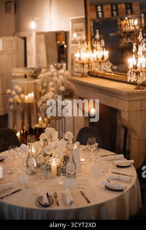Chic dining setup. Luxurious table setting featuring delicate lights ...
