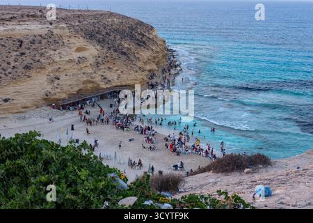 Summer beachgoers enjoy the famous Agiba 'miracle' beach cove near ...