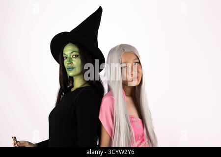 Two models dressed as witches for Halloween Stock Photo - Alamy