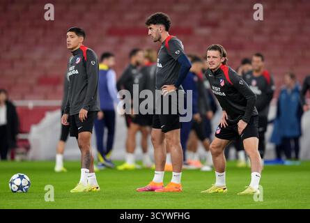Atletico Madrid's Nahuel Molina, right, and PSV's Ismael Saibari fight ...
