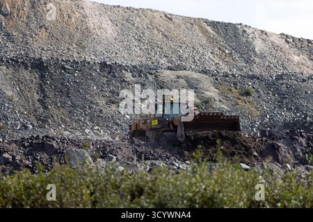 Tailings and rock layers from the Fire Lake iron mine rise above the ...