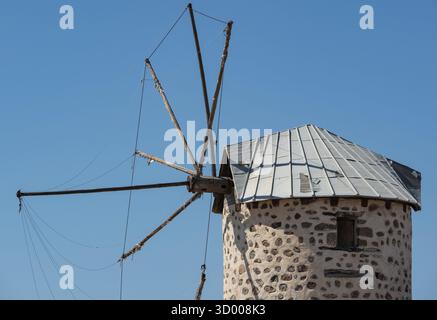 Architecture Details View of an ancient Greek mill and palm trees on ...