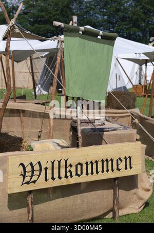 Entrance area at a medieval spectacle Welcome sign Entrance at a ...