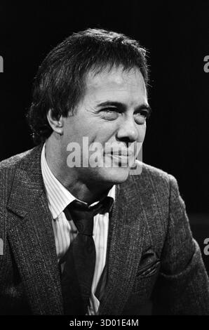 Portrait of French comedian Guy Bedos on stage, circa 1986 Stock Photo ...