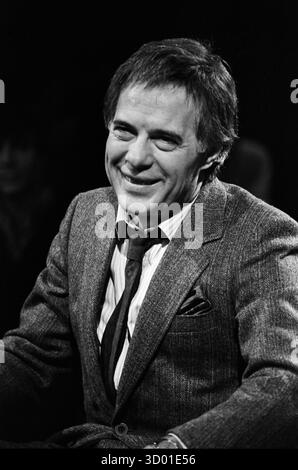 Portrait of French comedian Guy Bedos on stage, circa 1986 Stock Photo ...