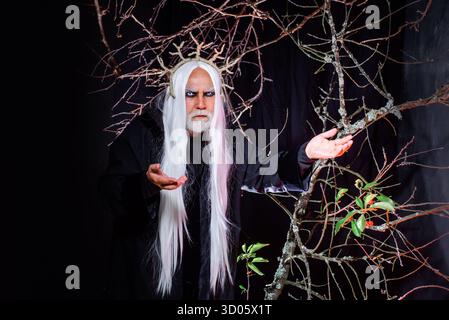 Man dressed as vampire for Halloween on red background Stock Photo - Alamy