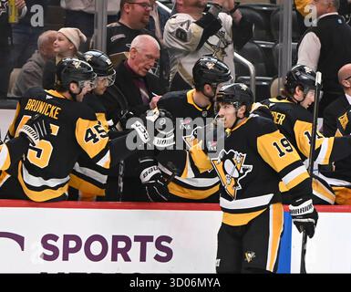 Pittsburgh Penguins' Connor Dewar (19) returns to the bench after ...