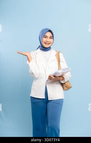 Smiling asian woman doctor demonstrating pills, vitamins, advertising ...