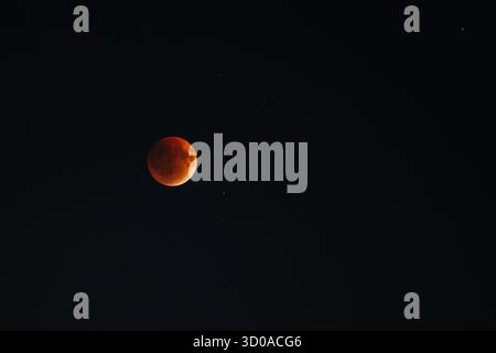 Full lunar eclipse or "blood moon" on the starry sky background Stock ...