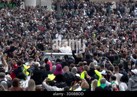 Pope Leo XIV waves as he arrives for his weekly general audience in St ...