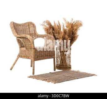 Wicker armchair with pampas grass and rug on beige background Stock ...