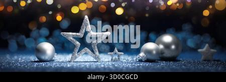 Sparkling silver glitter on blue background. Holiday blurred lights ...