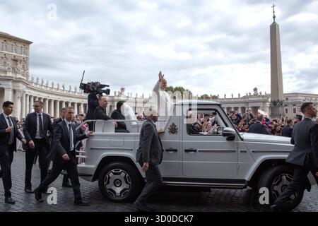Pope Leo XIV waves as he arrives for his weekly general audience in St ...