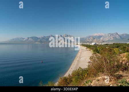 Aerial view of Konyaalti beach and pine-covered coastline at sunrise in ...