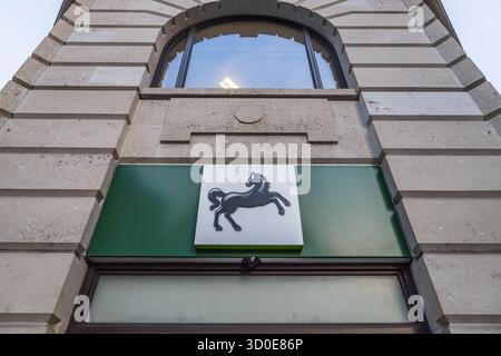 Sterling Bank & Trust logo on branch window with pedestrian reflection ...