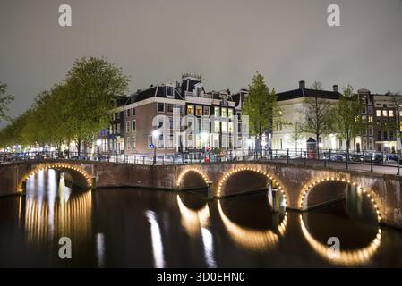 Canals of Amsterdam at night. Amsterdam is the capital and most ...