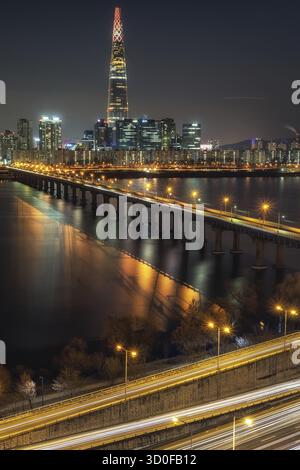 The iconic lotte tower taken at night with the view of jamsil railway ...
